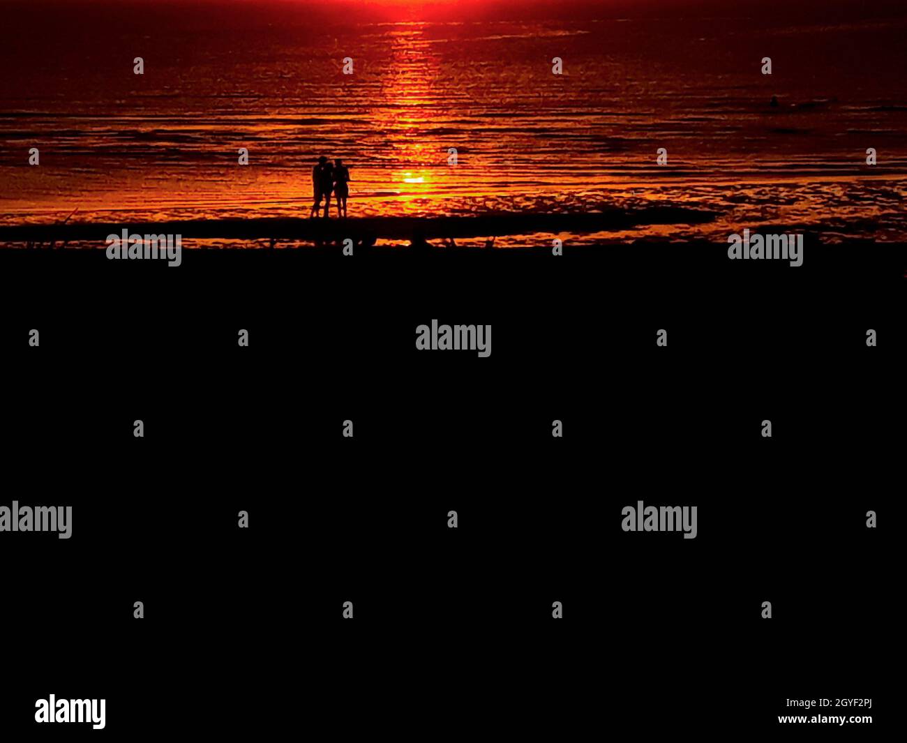 Beach sunset silhouette scene, montevideo city, uruguay Stock Photo - Alamy