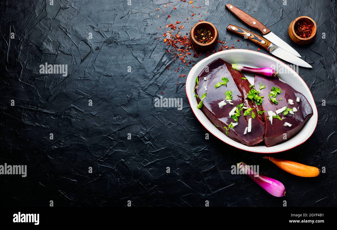 Piece of raw beef liver on the kitchen table.Fresh liver for cooking Stock Photo - Alamy