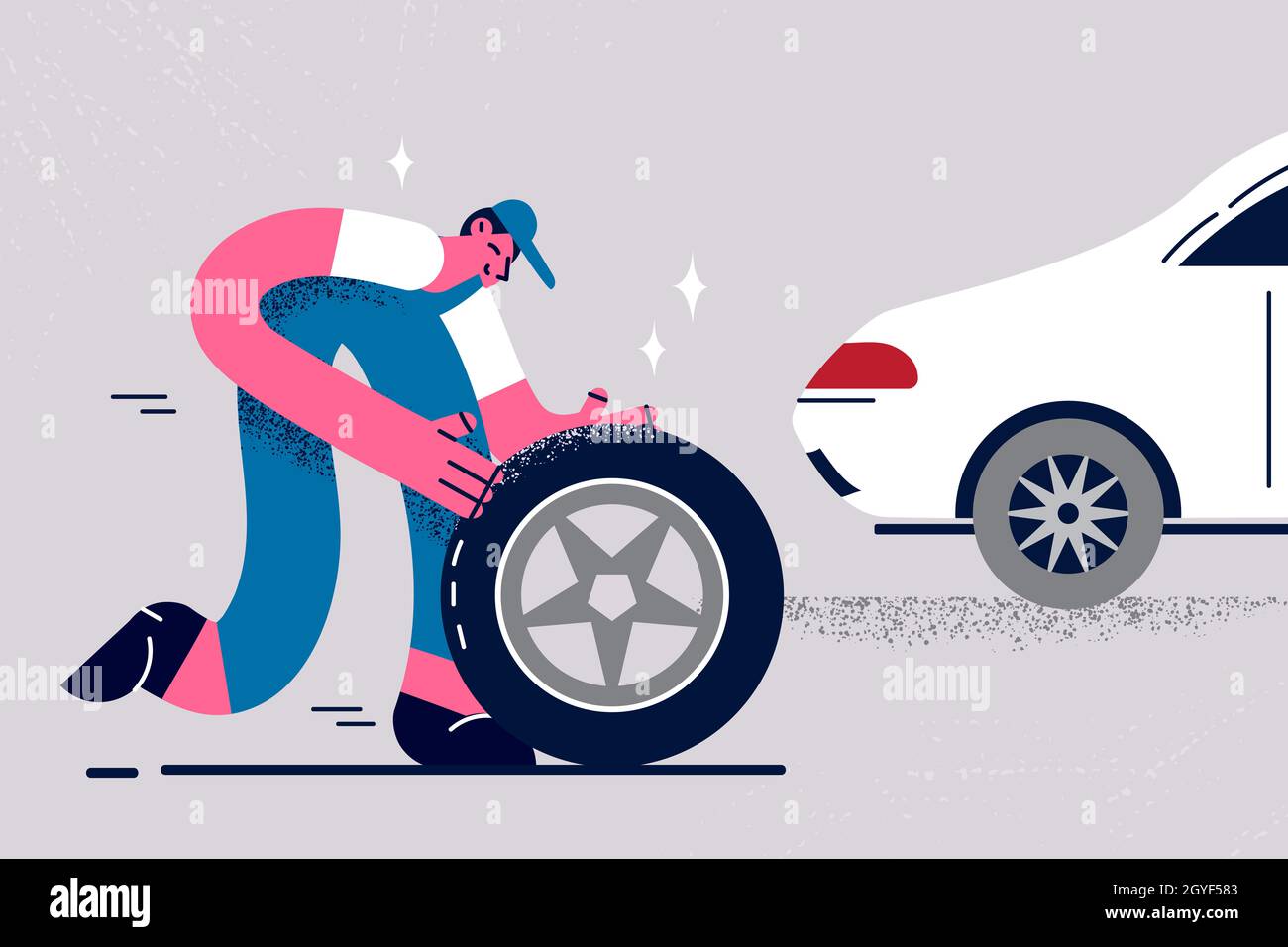 Repairman and changing car wheels concept. Young worker in uniform and ...