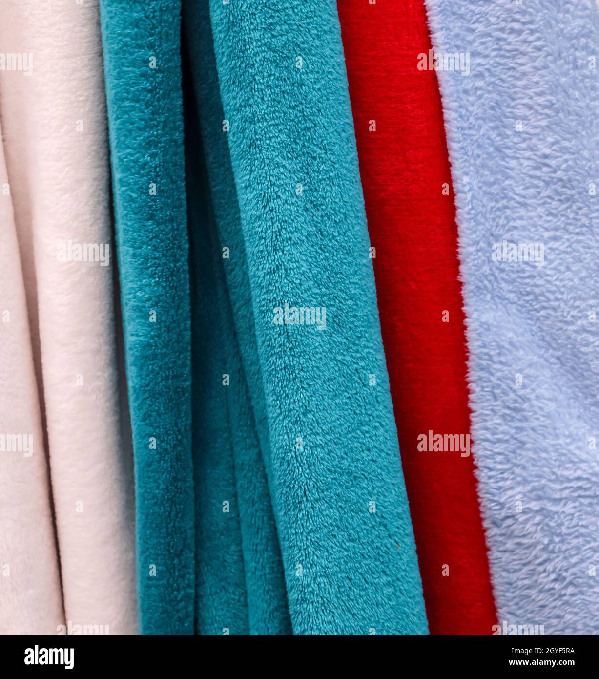 Detailed close up view on samples of cloth and fabrics in different ...