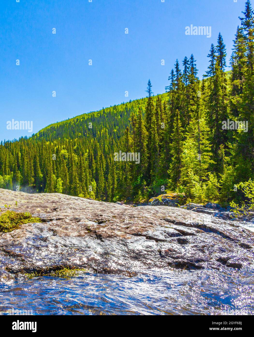 Fast flowing river water of the waterfall Rjukandefossen in Hemsedal ...