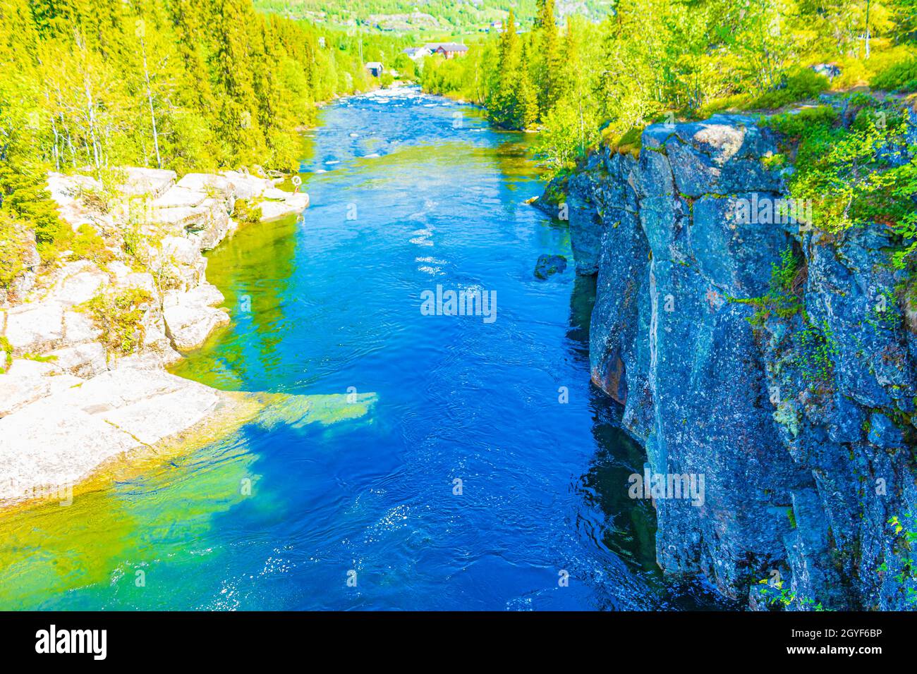 River of the beautiful waterfall Rjukandefossen with mountain and ...