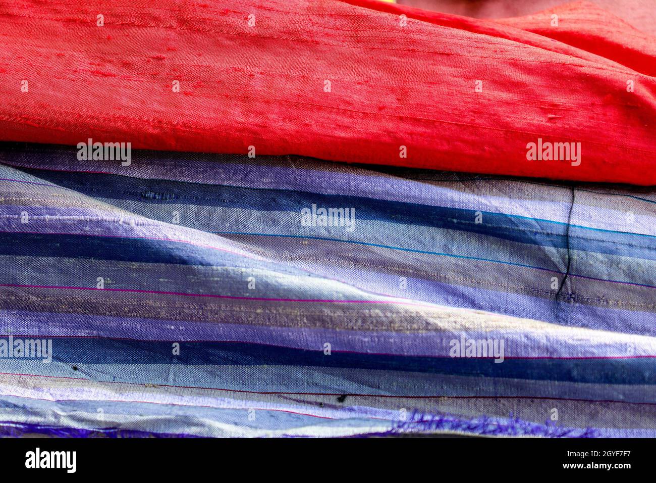 Detailed close up view on samples of cloth and fabrics in different ...