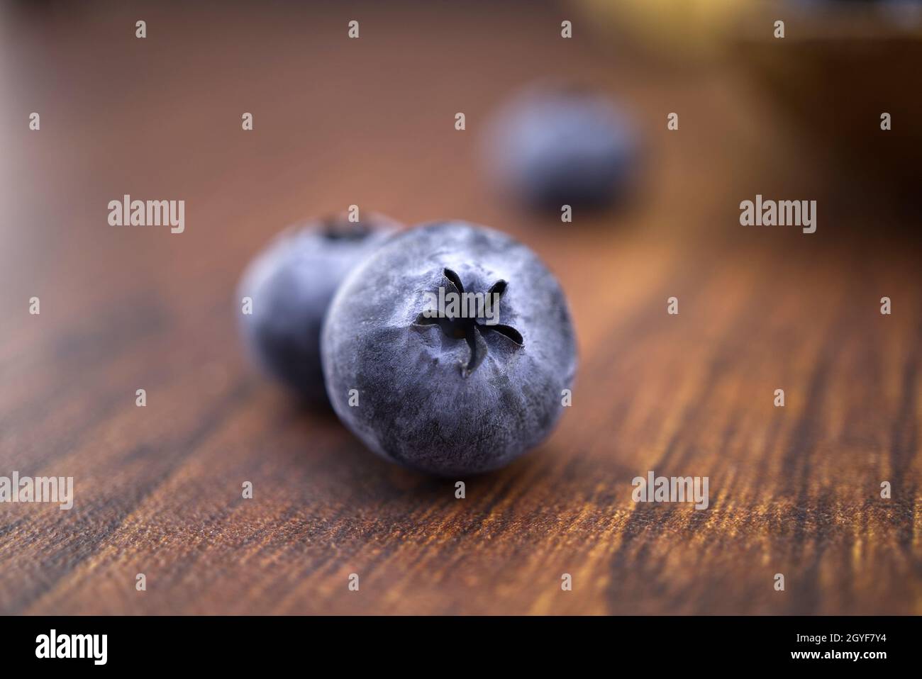 Macro composition of fresh blueberries in a selective focus view on a ...