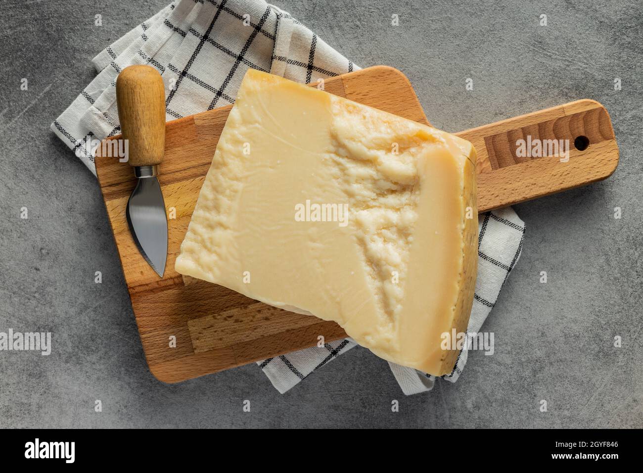 Block of italian parmesan cheese on kitchen table. Top view Stock Photo ...