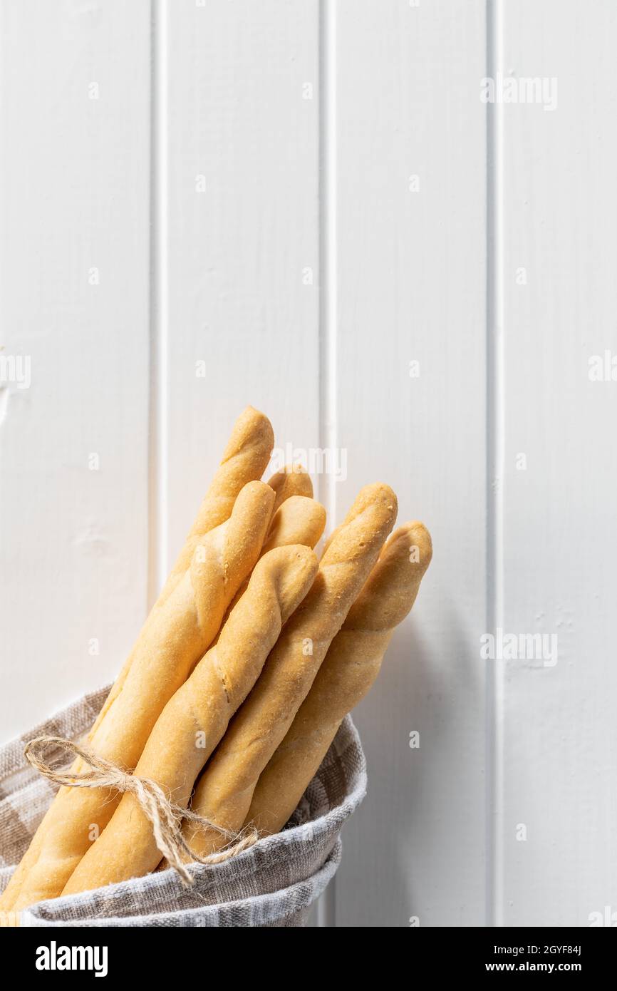 Grissini sticks. Traditional italian bread sticks on white table. Top ...