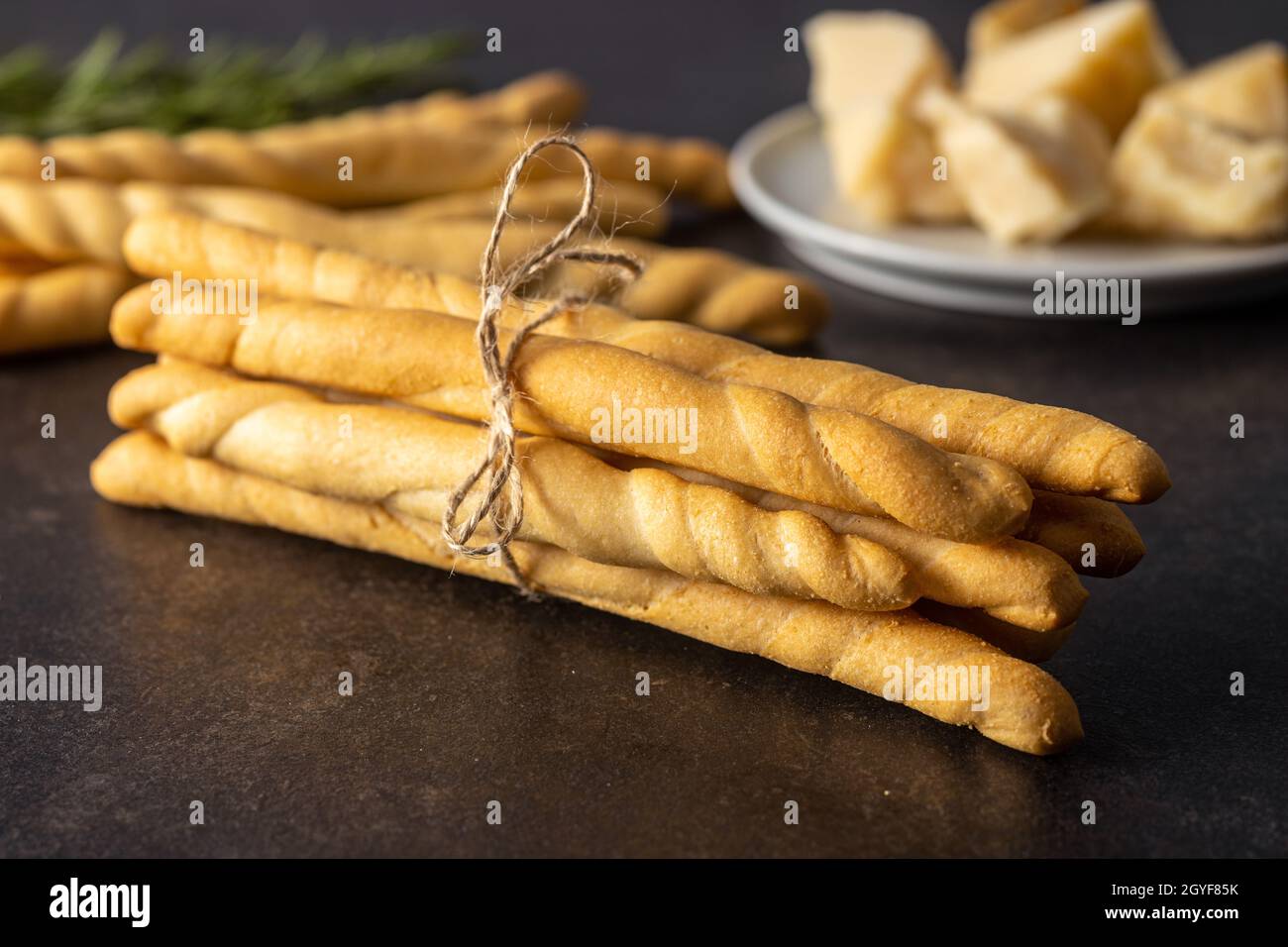 Grissini sticks. Traditional italian bread sticks on black table Stock ...