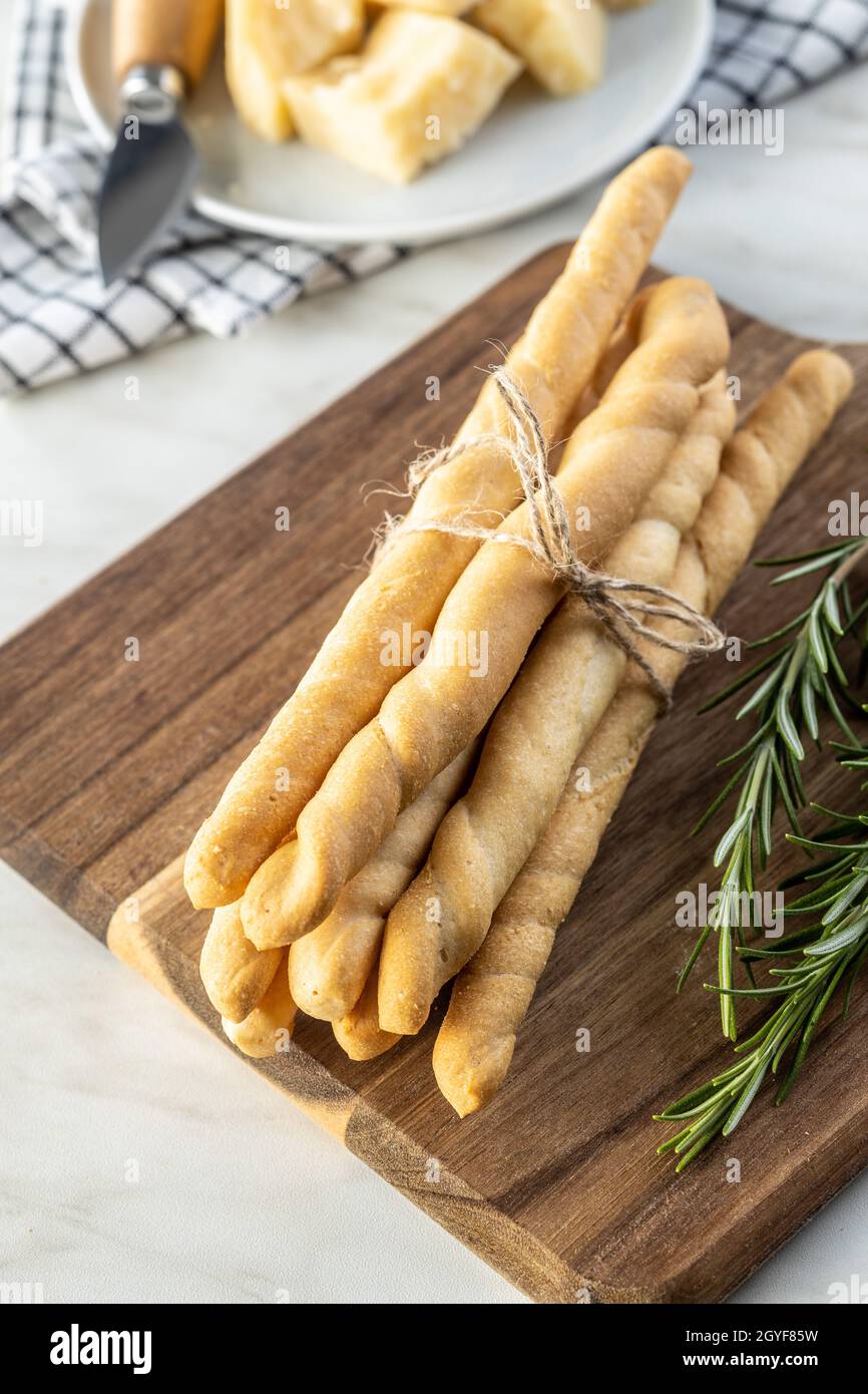 Grissini sticks. Traditional italian bread sticks on cutting board ...