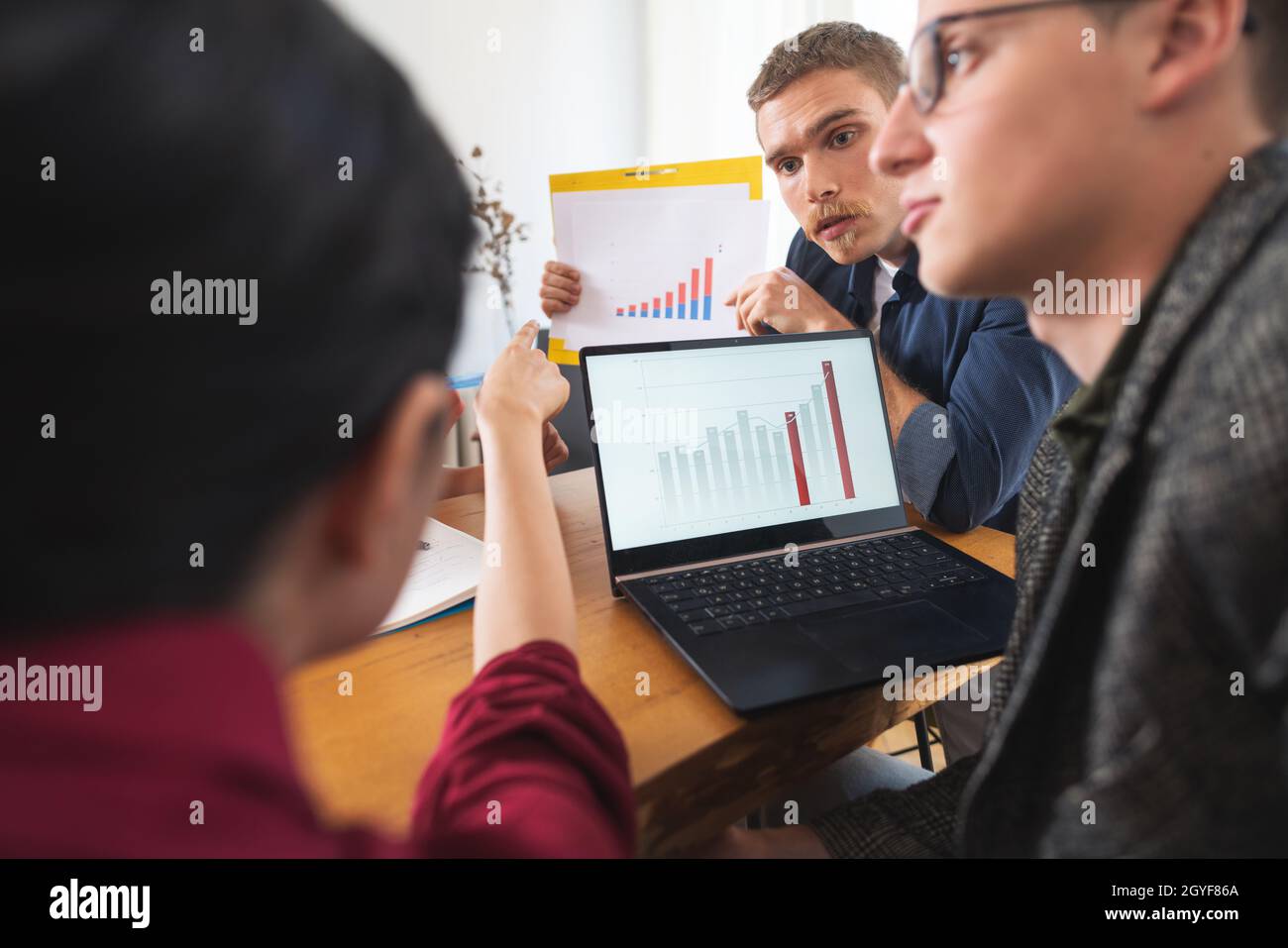Person pointing graphs hi-res stock photography and images - Alamy