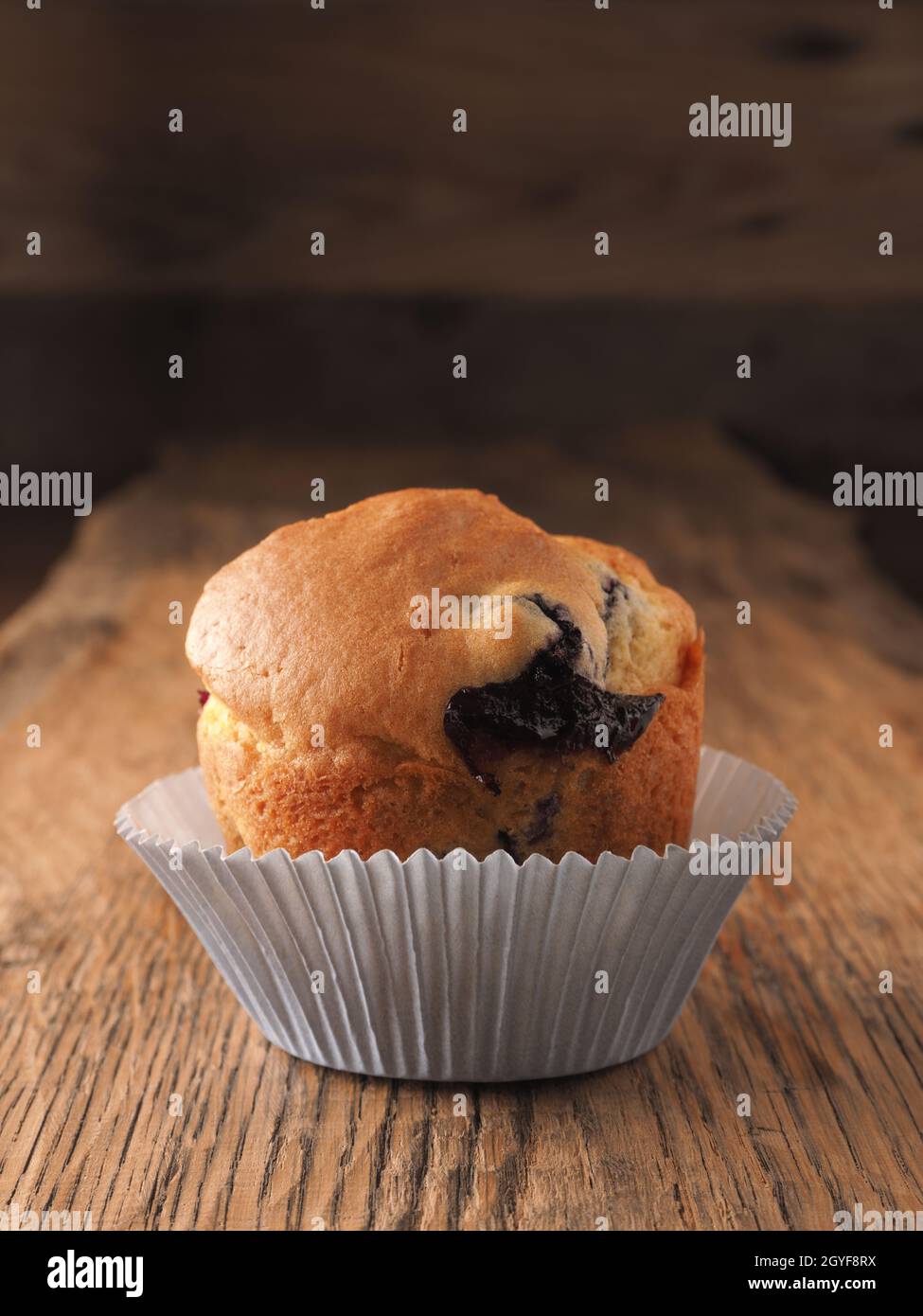Blueberry muffin on a rustic wooden kitchen table, tasty food Stock ...