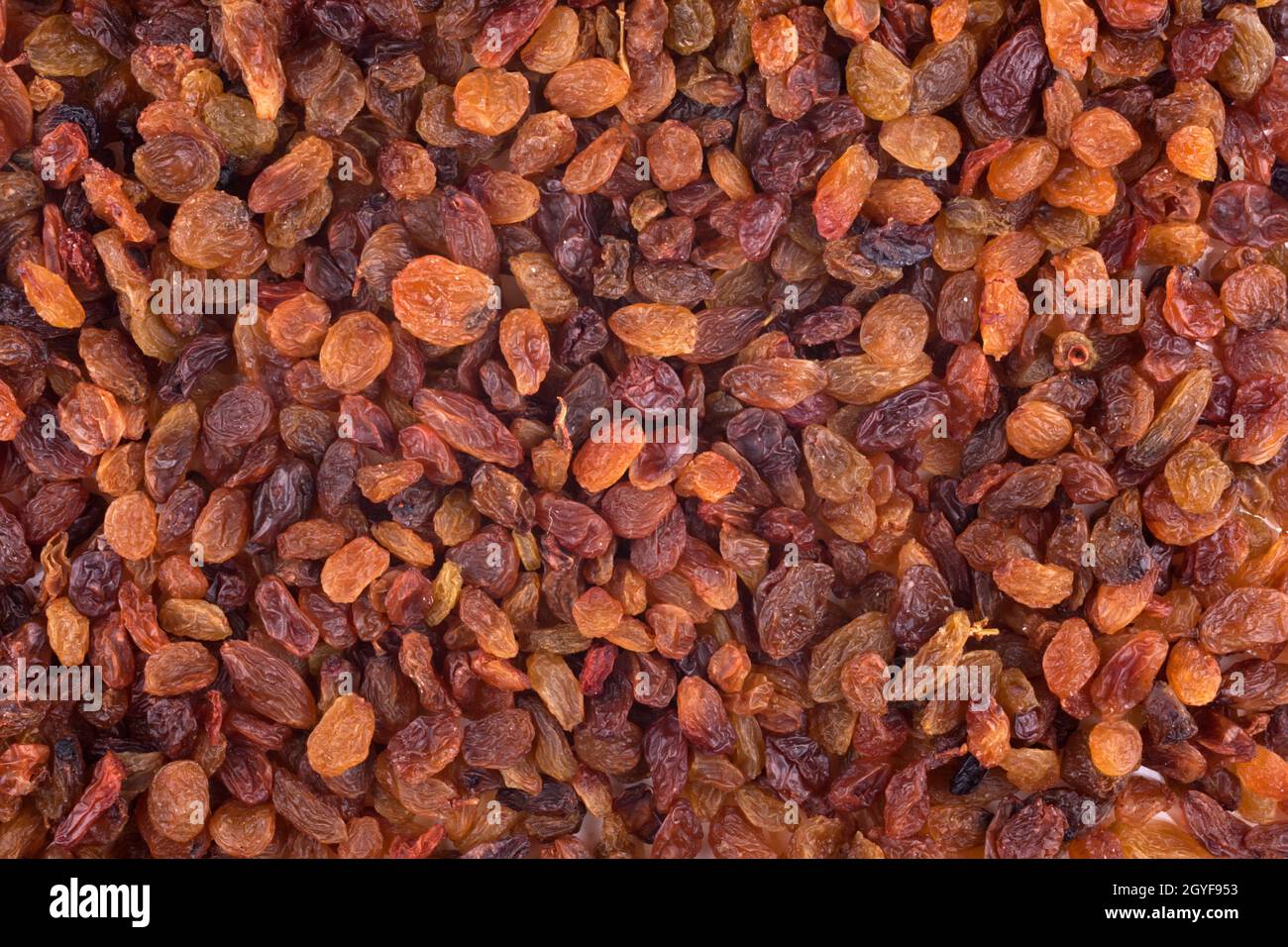 Golden raisins background Stock Photo - Alamy
