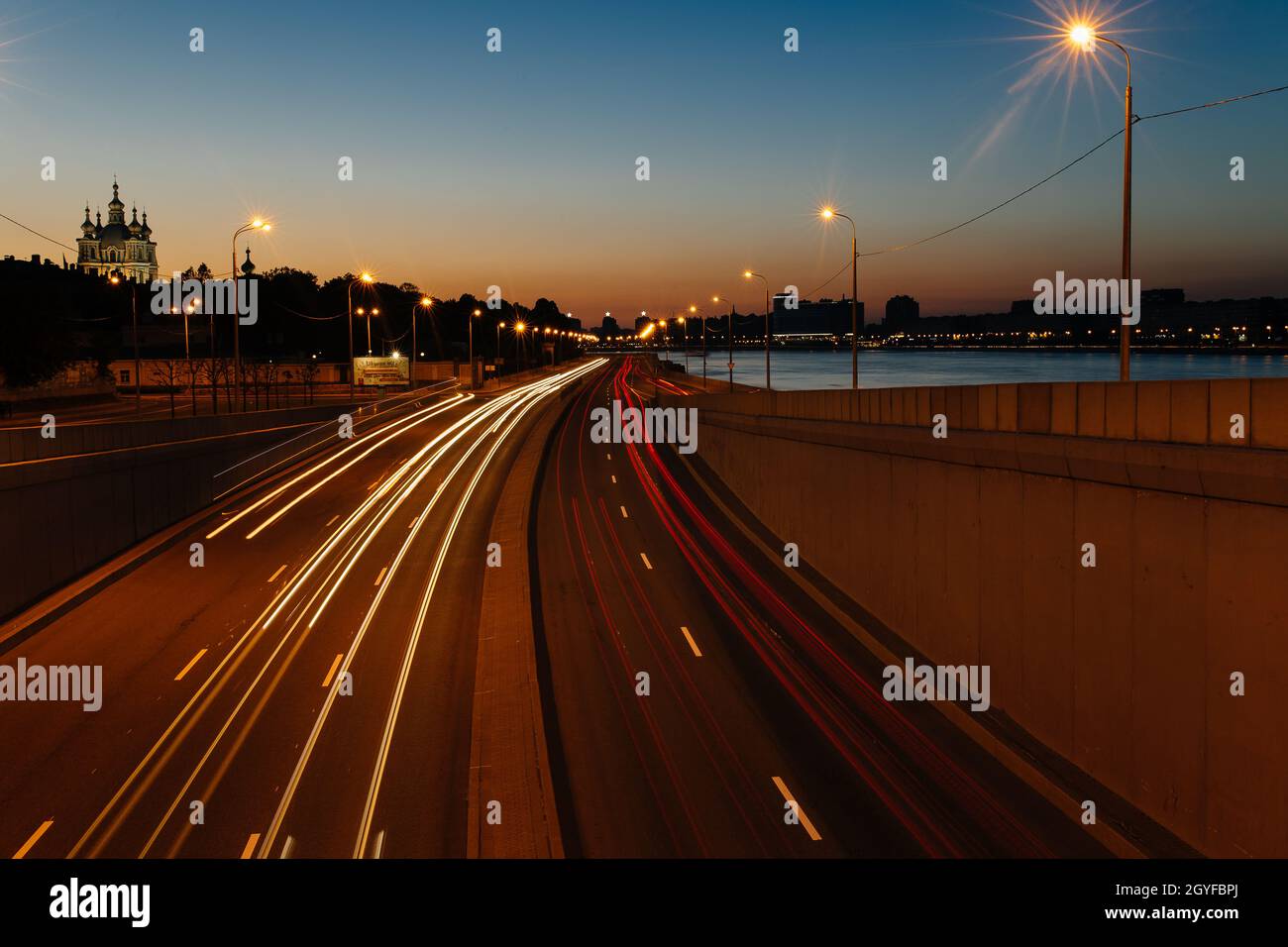 Aerial view of an empty highway beside the pier at sunset Stock Photo ...