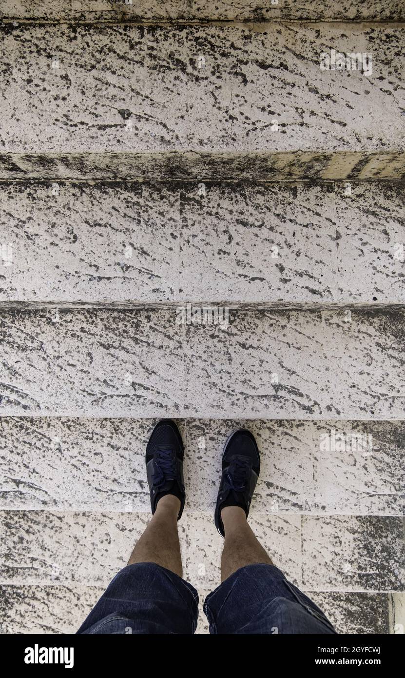 Detail of young man climbing some stairs, exercise and healthy life ...