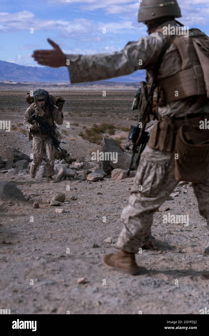 A U.S. Marine with 1st Battalion, 3d Marines, rushes to an obstacle ...