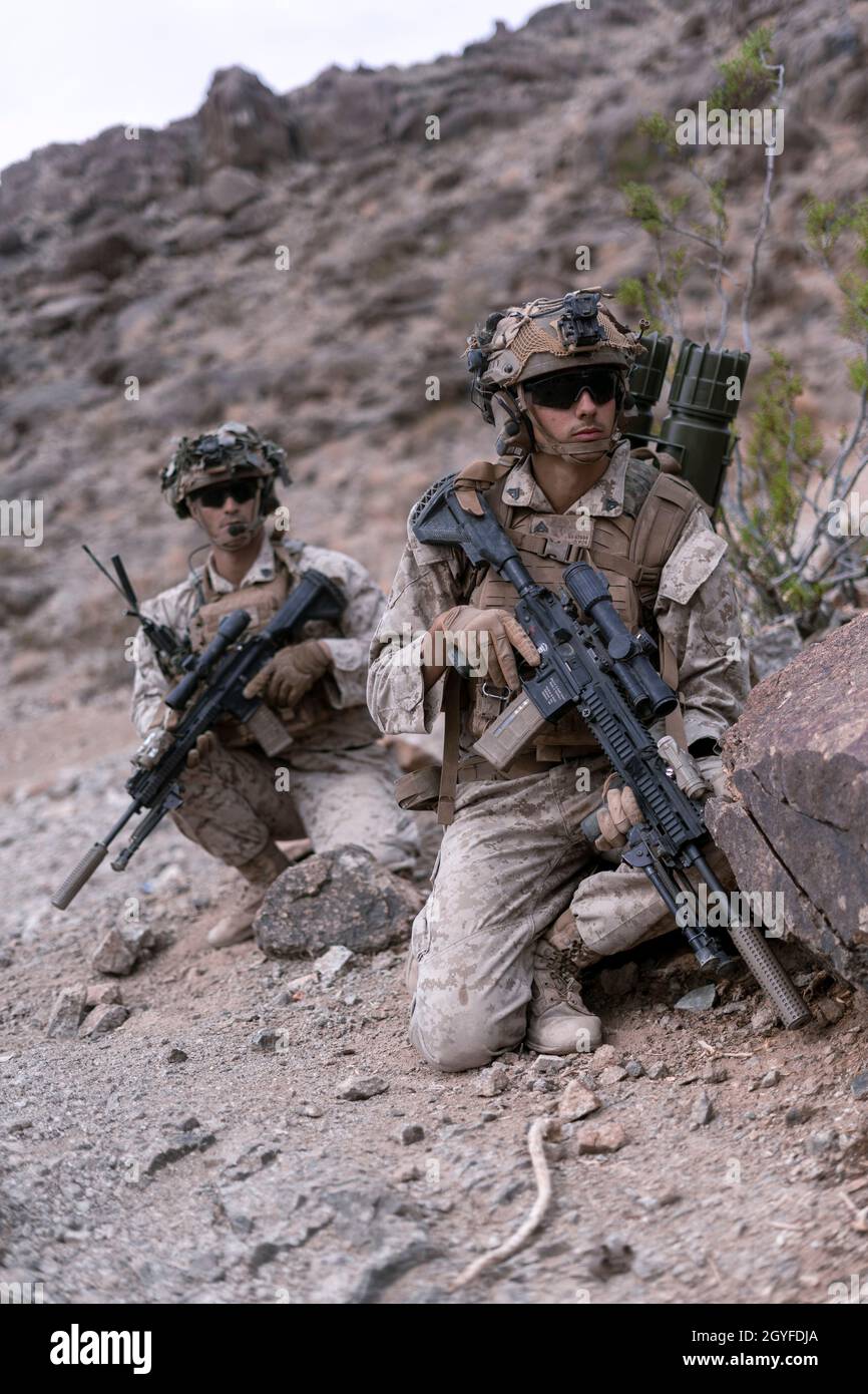U.S. Marines with 1st Battalion, 3d Marines, observe an objective on ...