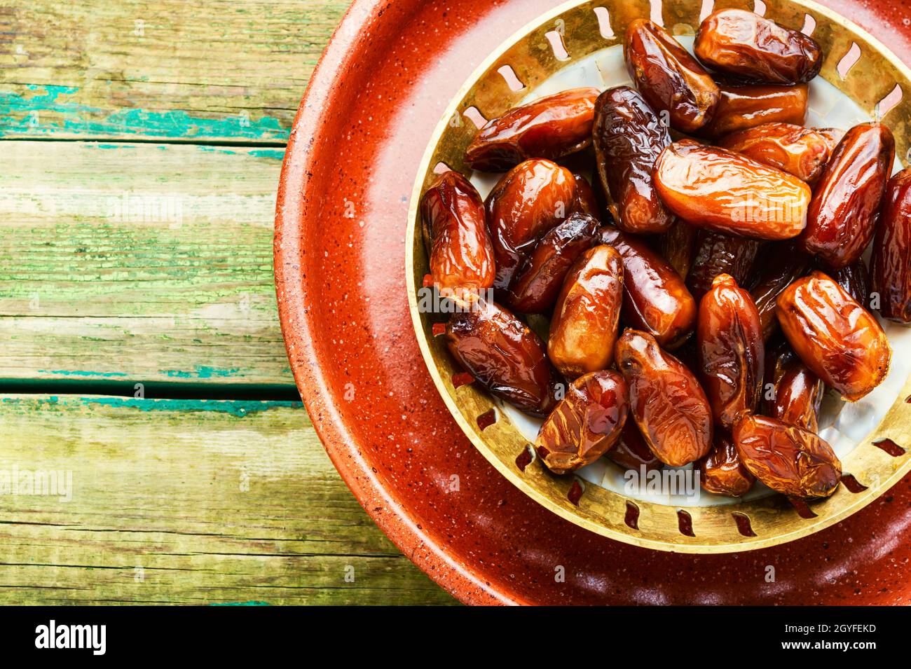 Dried sweet dates in bowl.Organic dates.Sweet food Stock Photo - Alamy