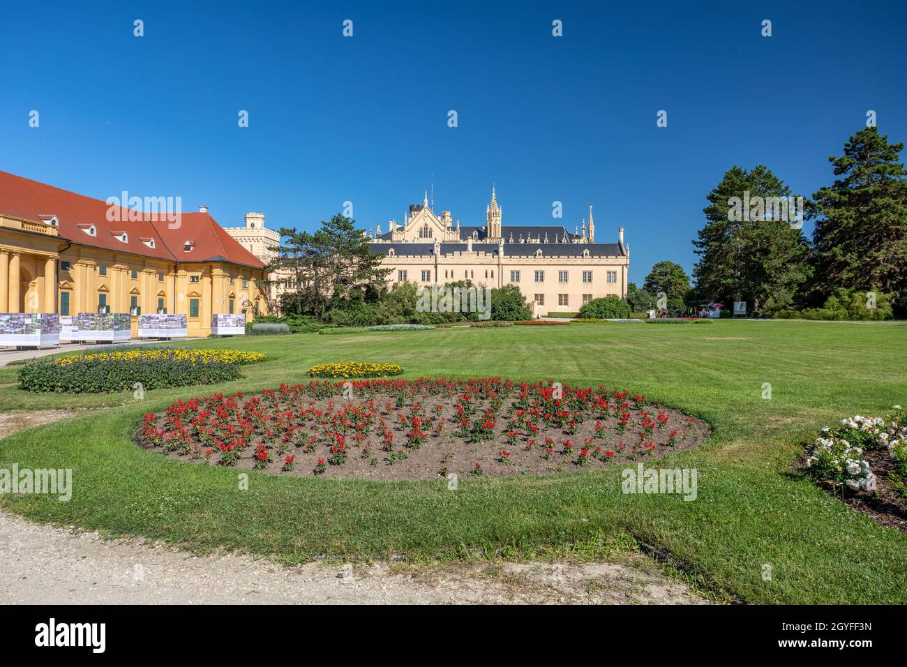 Lednice Chateau with beautiful gardens with flowers and parks on sunny ...