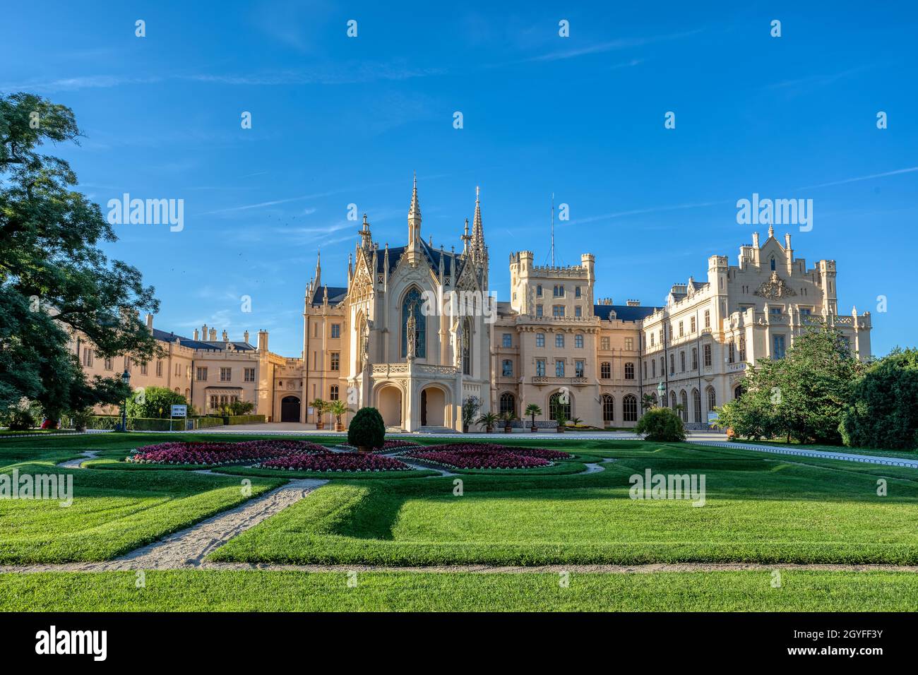 Lednice Chateau with beautiful gardens with flowers and parks on sunny ...