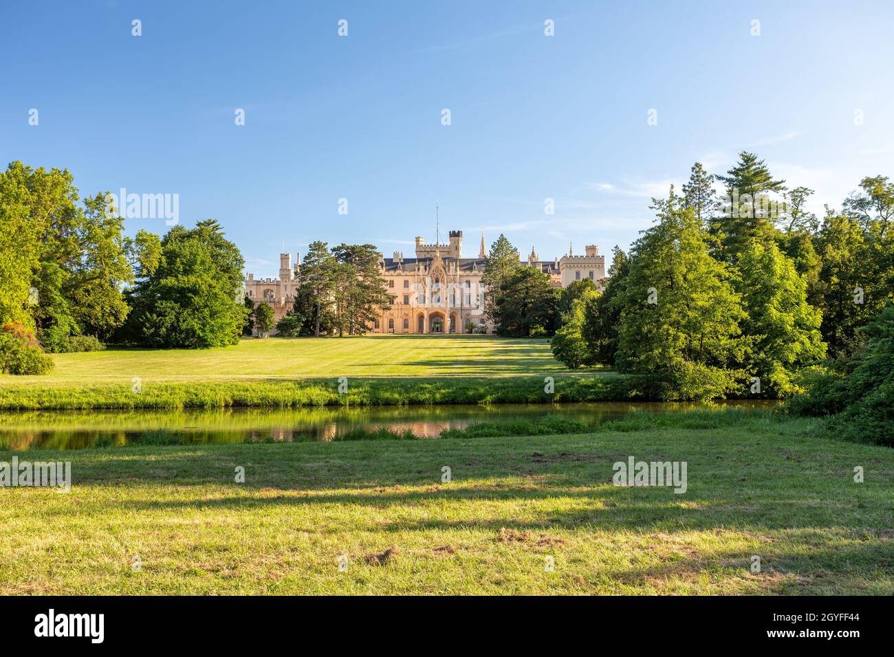 Lednice Chateau with beautiful gardens with flowers and parks on sunny ...