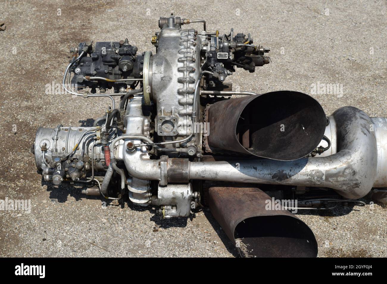 The helicopter engine which is pulled out outside. Spare parts and ...