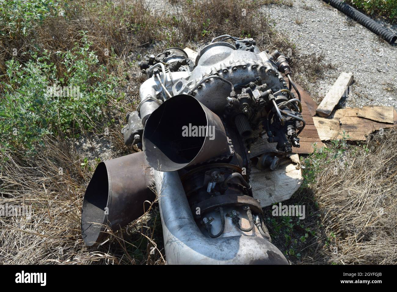 The helicopter engine which is pulled out outside. Spare parts and ...