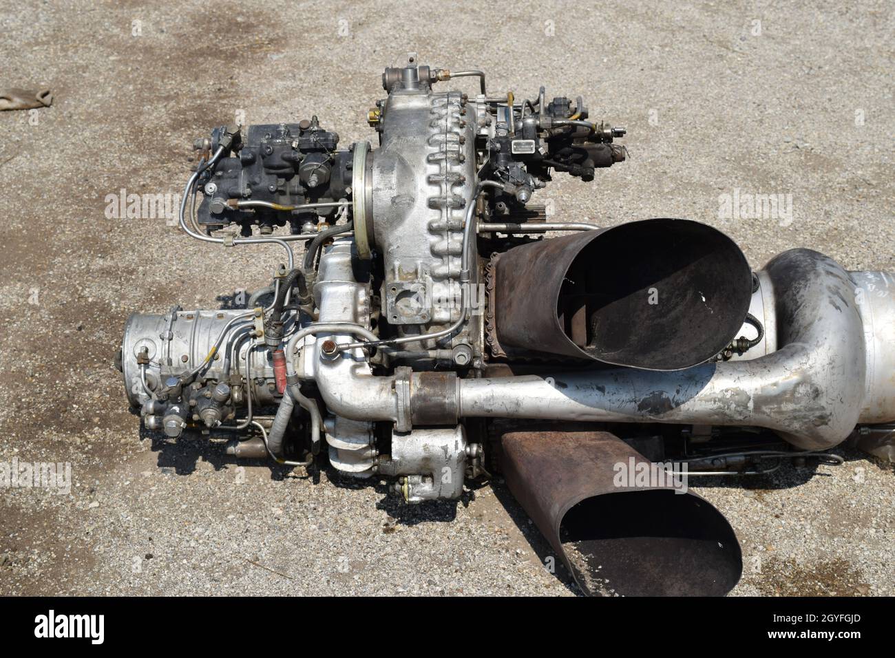 The helicopter engine which is pulled out outside. Spare parts and ...