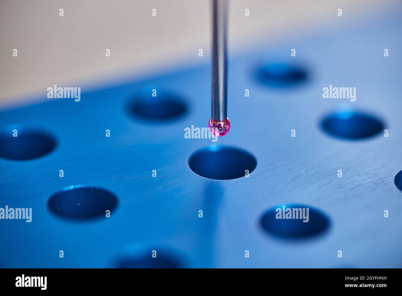 Blue test block with CMM Programming probe featuring purple tip Stock ...