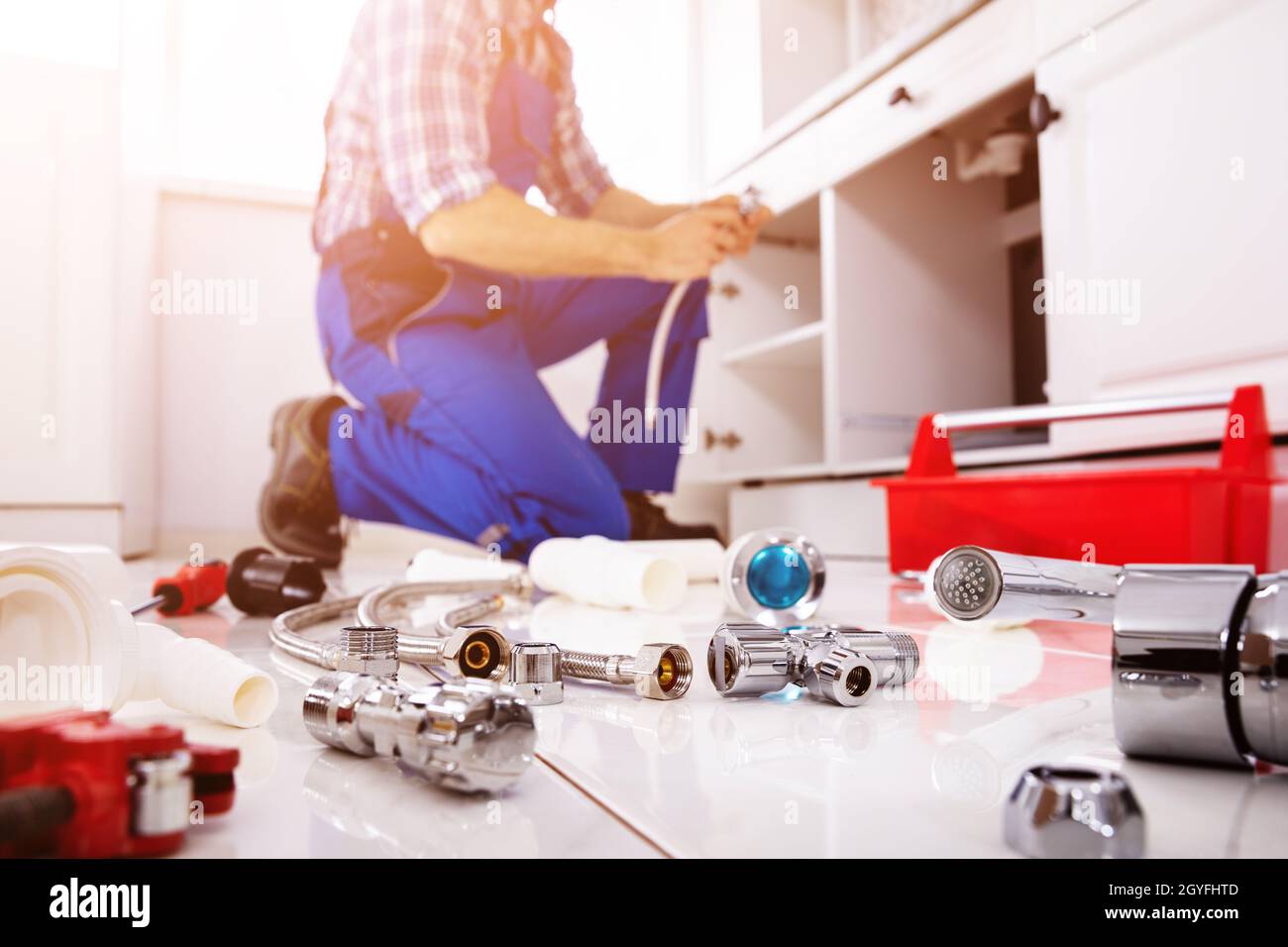 Plumber Cleaning Kitchen Pipe Using Tools. Sewer Maintenance Stock ...
