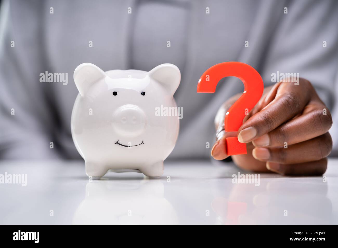 Piggy bank question mark hi-res stock photography and images - Alamy