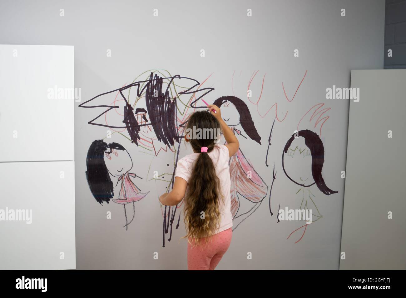 Little Child Girl Drawing. Cute Kid Having Fun Stock Photo - Alamy