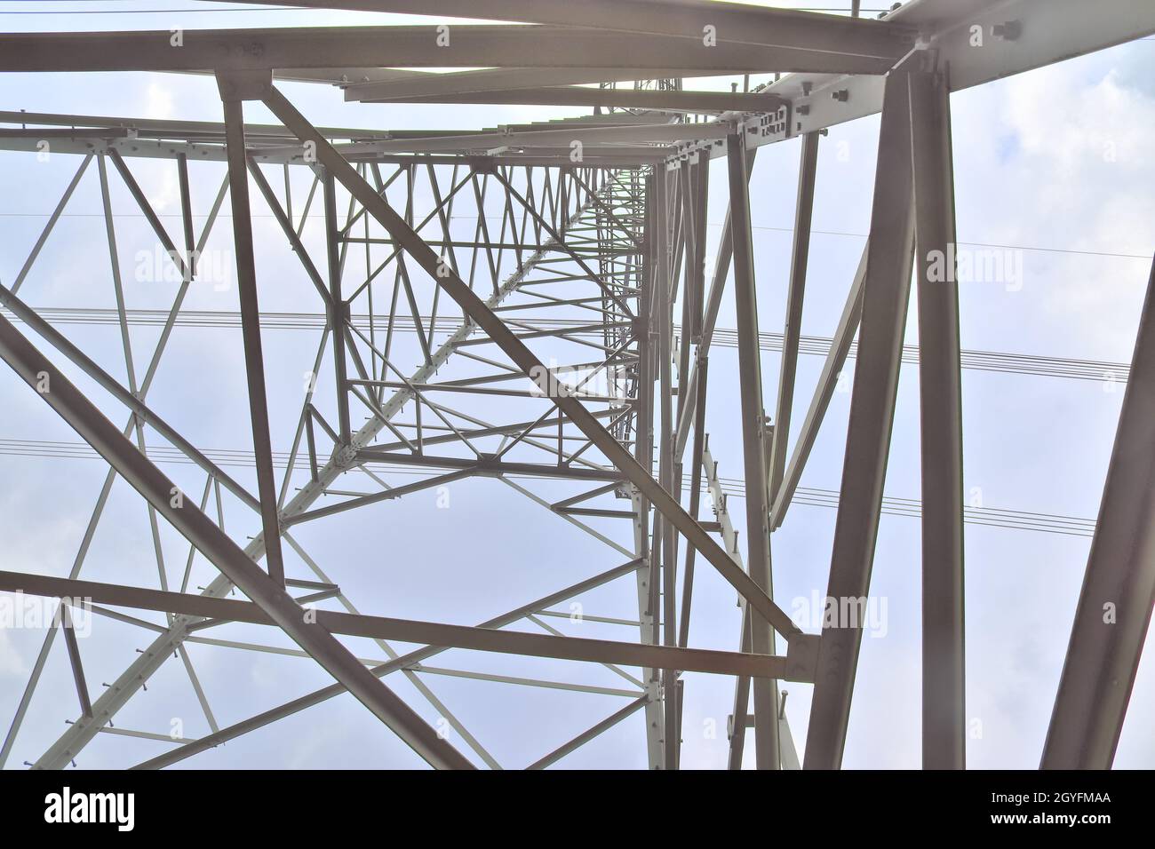 Close up view on a big power pylon transporting electricity in a ...