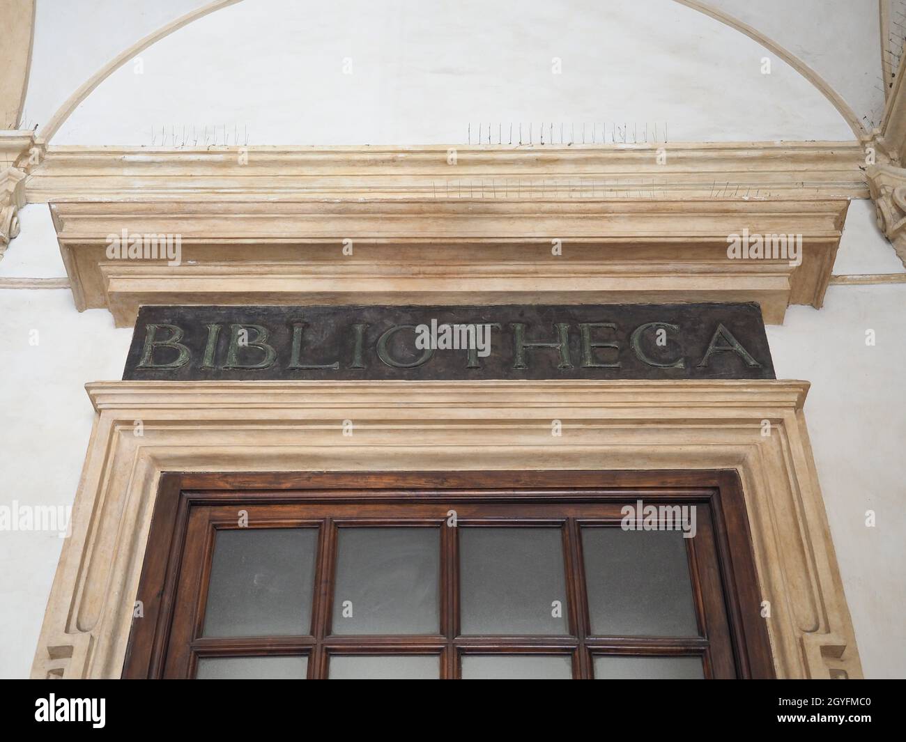 Latin bibliotheca sign (translation: library) over ancient door Stock ...