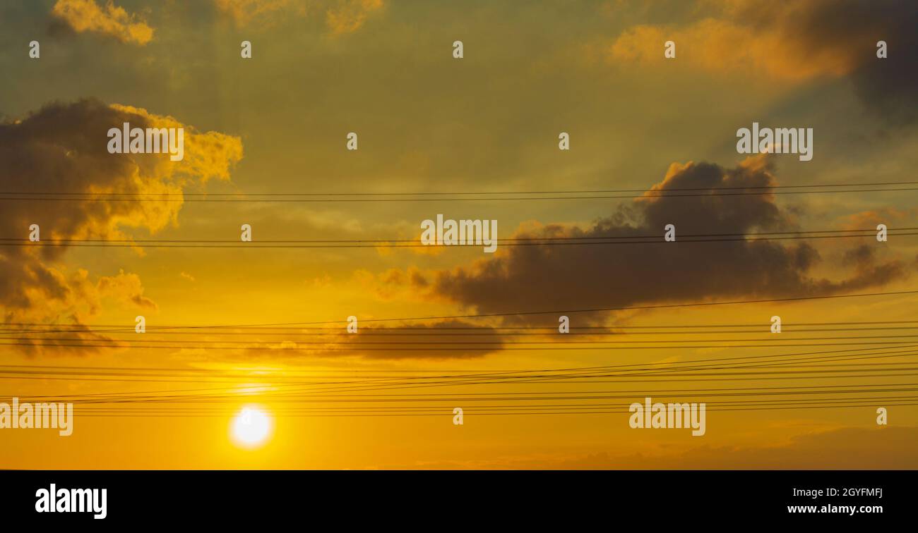 Golden and colorful sunset with orange yellow blue and green colors ...