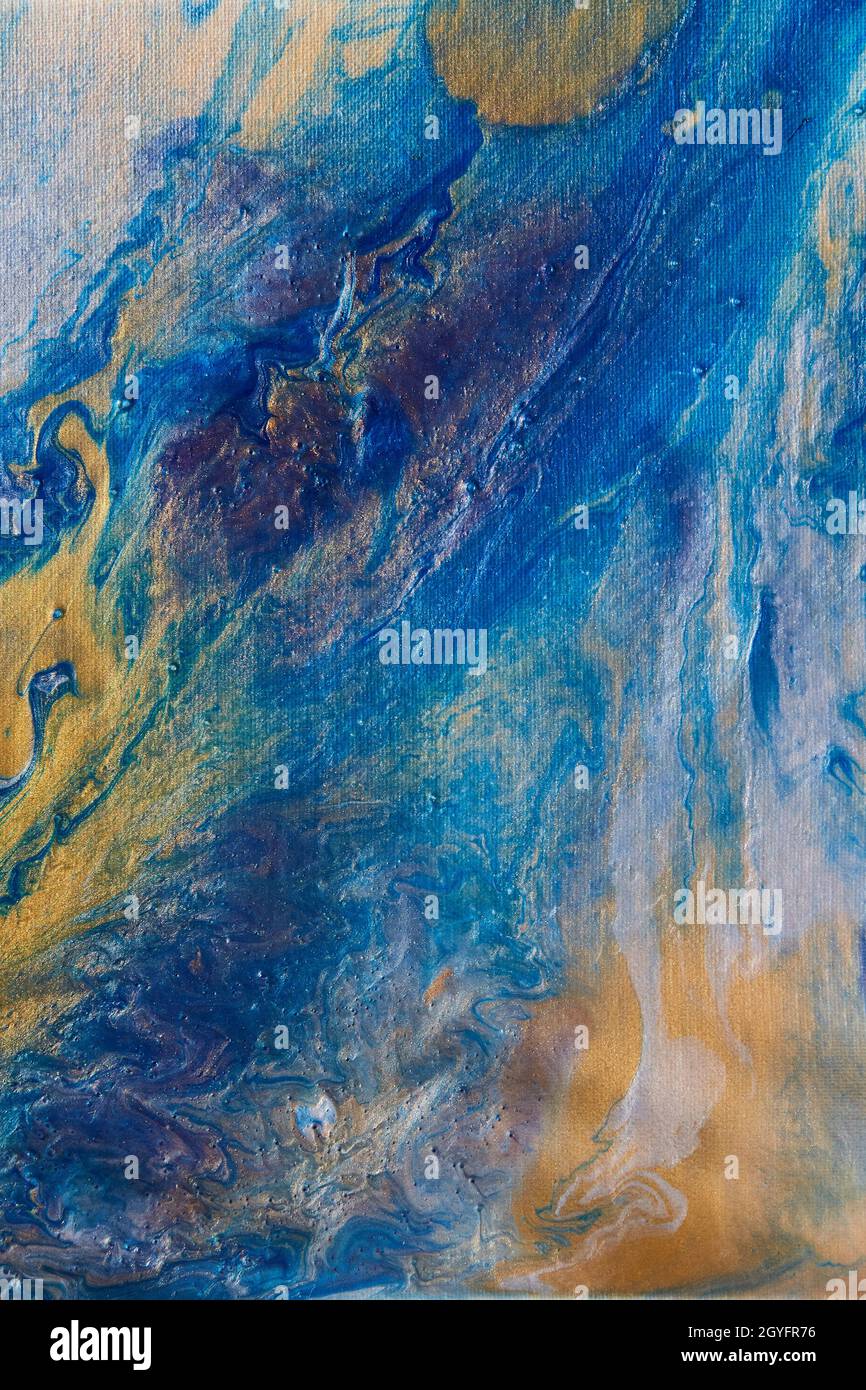 Acrylic pouring painting texture of blues and gold Stock Photo - Alamy