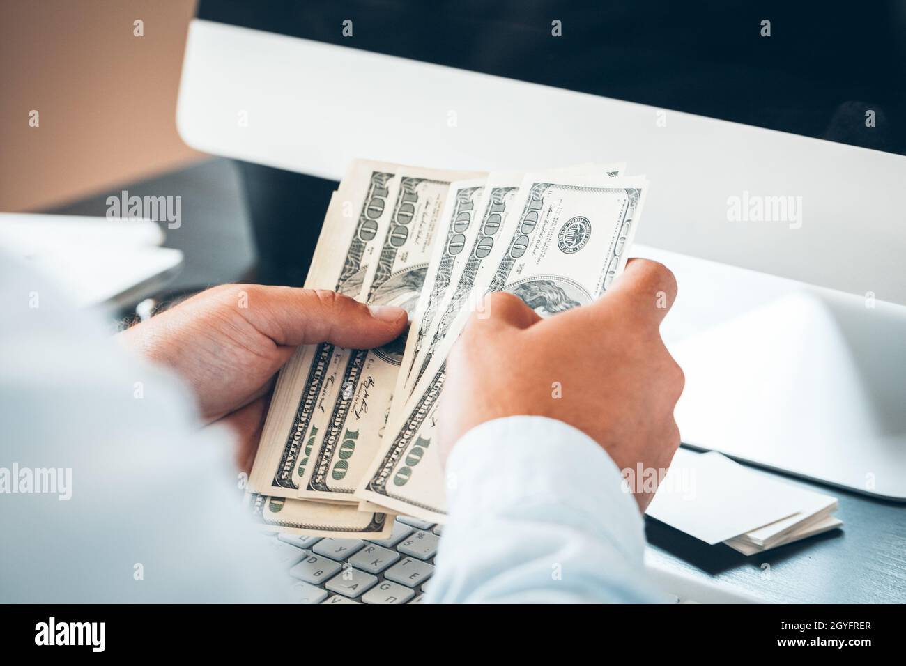 Caucasian hands counting dollar banknotes Stock Photo - Alamy