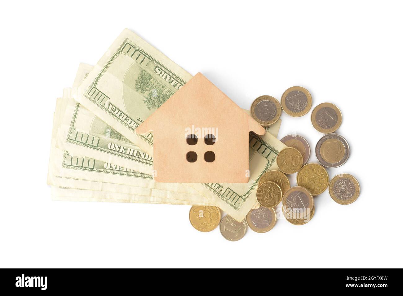 Wooden house and money on white background Stock Photo - Alamy