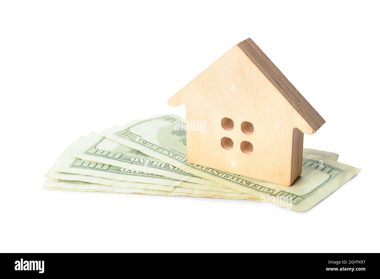 Wooden house and money on white background Stock Photo - Alamy