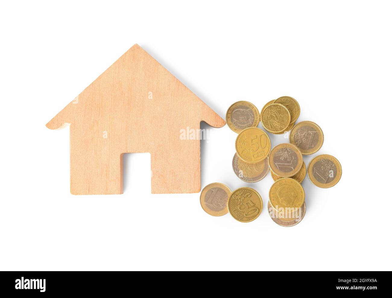 Wooden house and coins on white background Stock Photo - Alamy