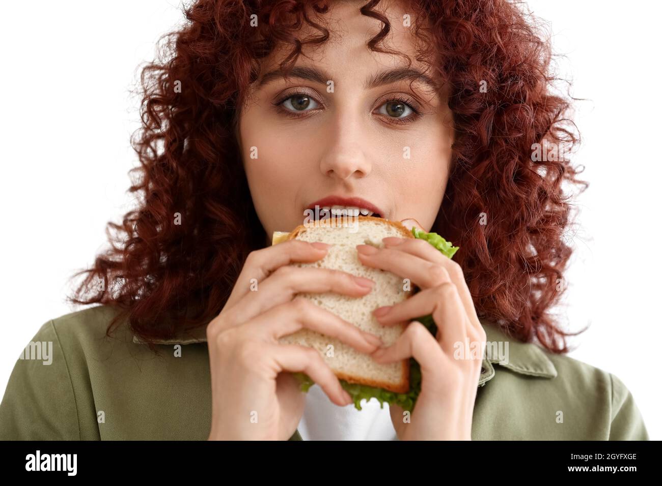 Woman eating bread triangle sandwich hi-res stock photography and ...
