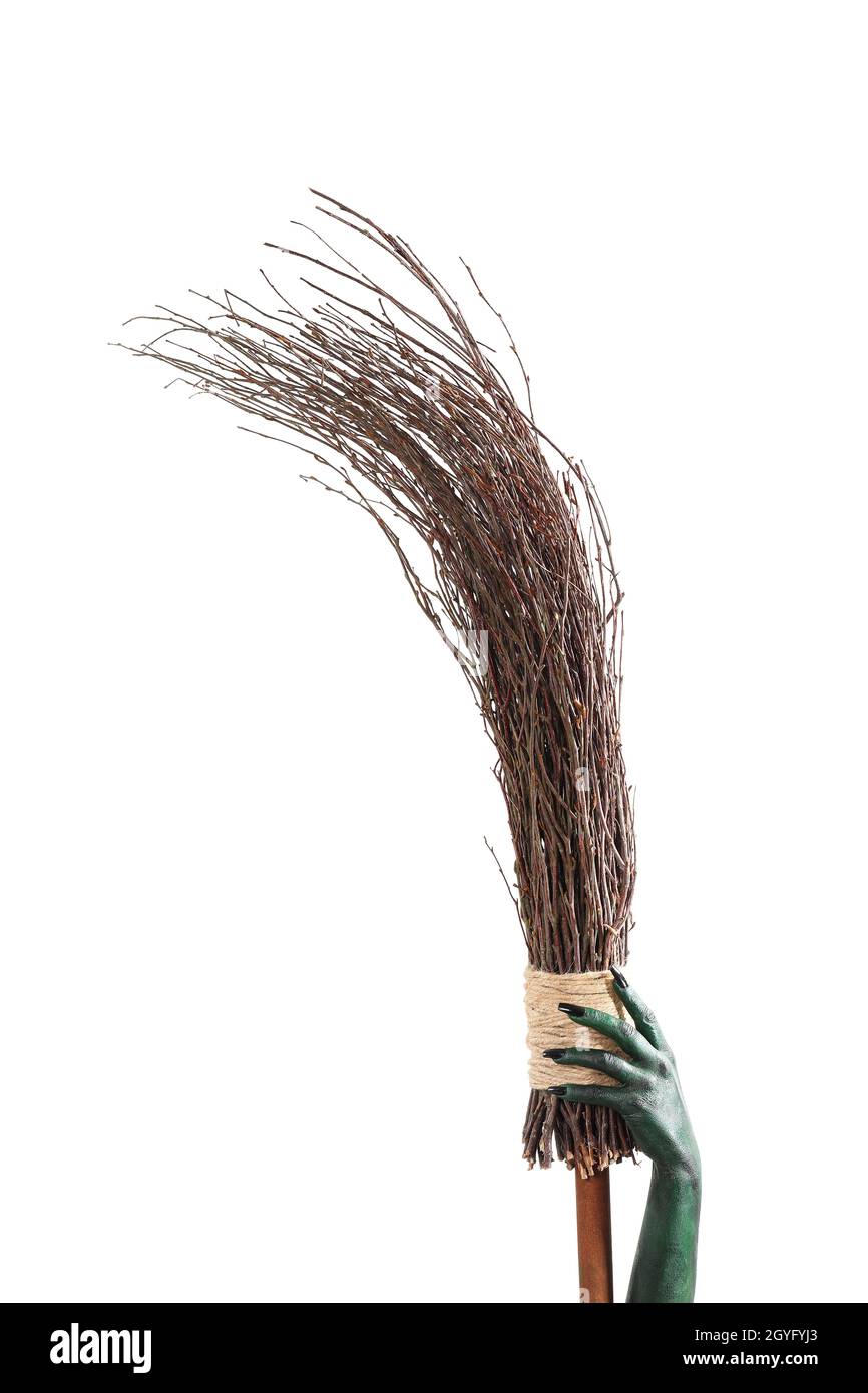 Magic broom in witch's hand isolated on white Stock Photo - Alamy