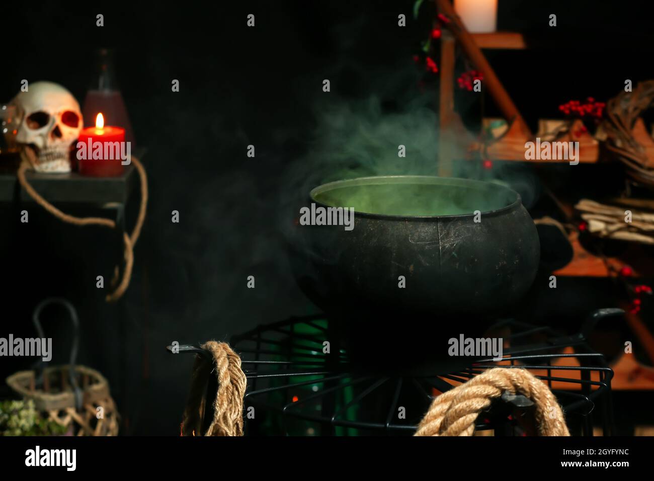 Cauldron with potion in witch's lair Stock Photo - Alamy