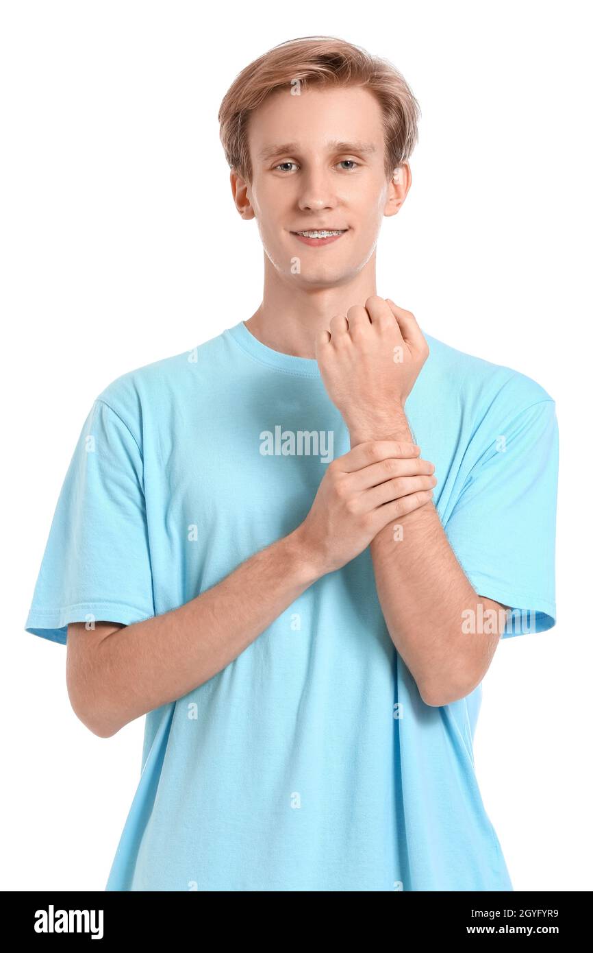 Sporty young man counting pulse on white background Stock Photo - Alamy