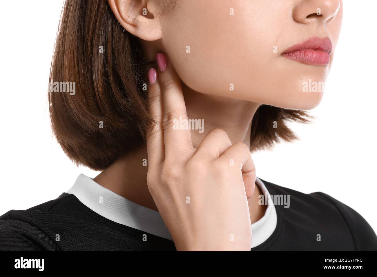Sporty young woman counting pulse on white background, closeup Stock ...