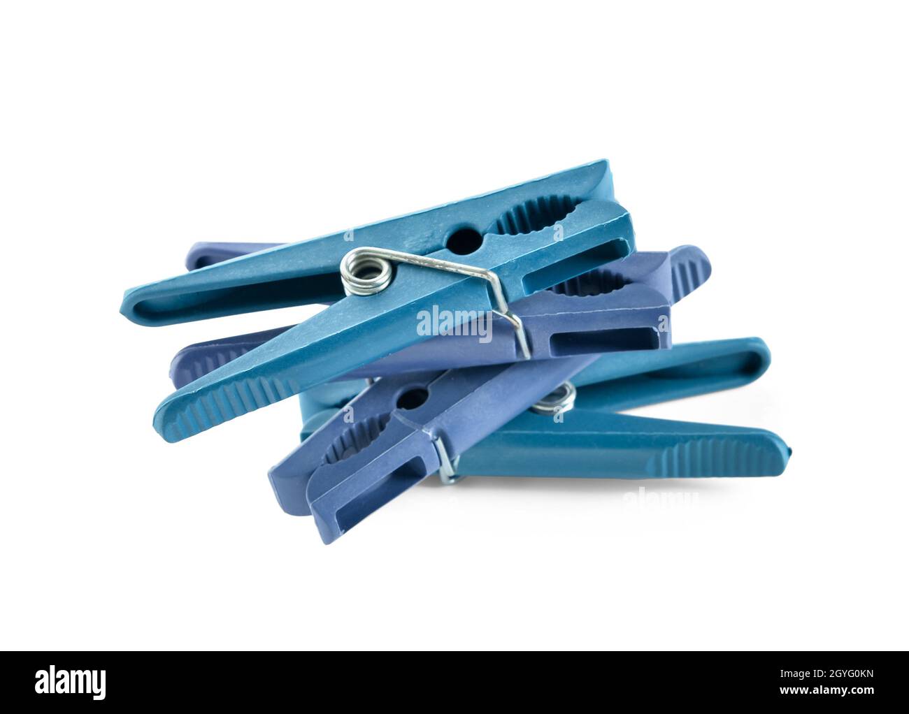 Blue plastic clothespins on white background Stock Photo - Alamy