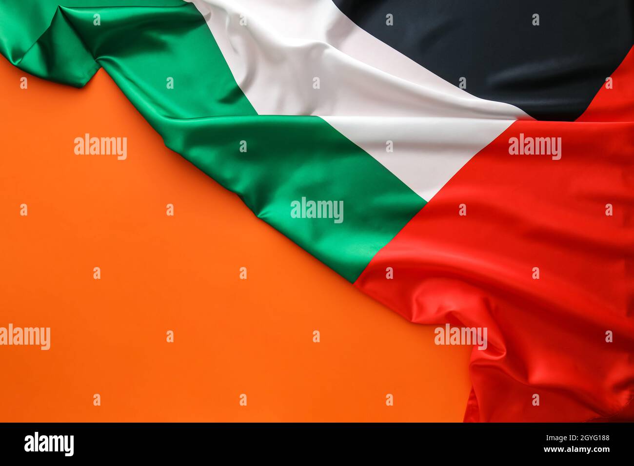 UAE national fabric flag on red background, closeup Stock Photo - Alamy