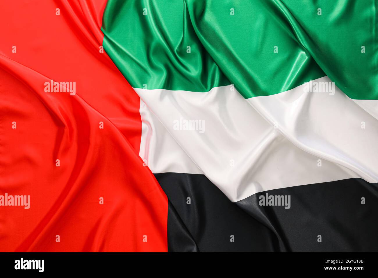 UAE national fabric flag as background Stock Photo - Alamy