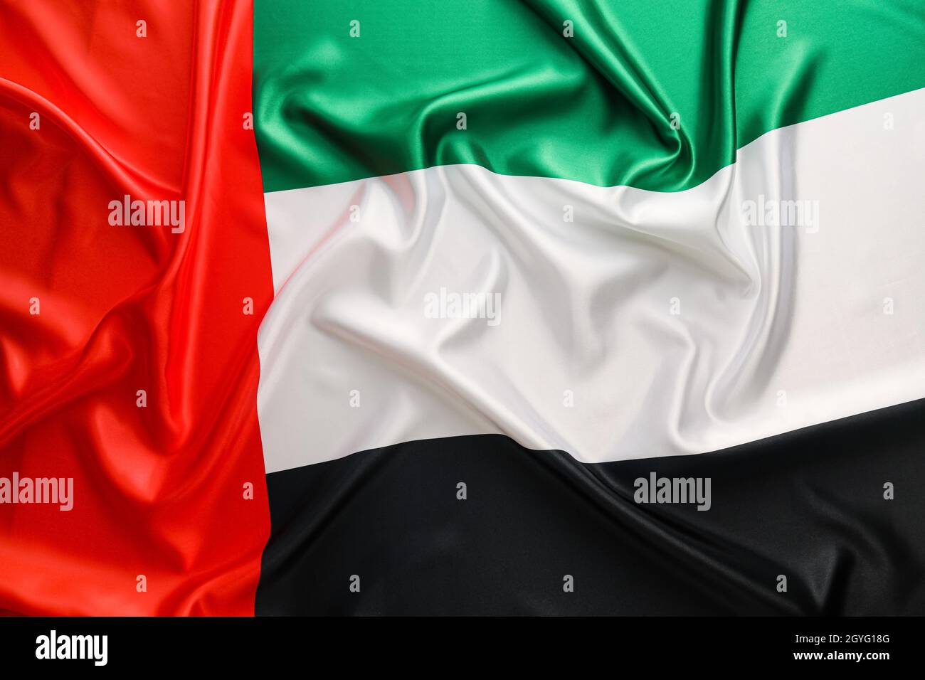 United Arab Emirates flag as background Stock Photo - Alamy