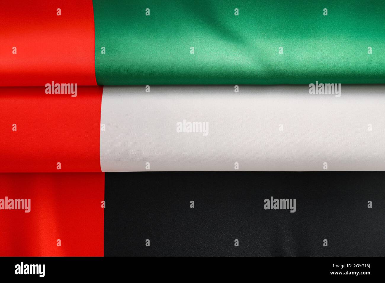 Waving United Arab Emirates flag as background Stock Photo - Alamy