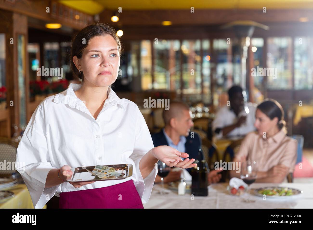 Waiter demonstrating his upset with little tips from restaurant ...