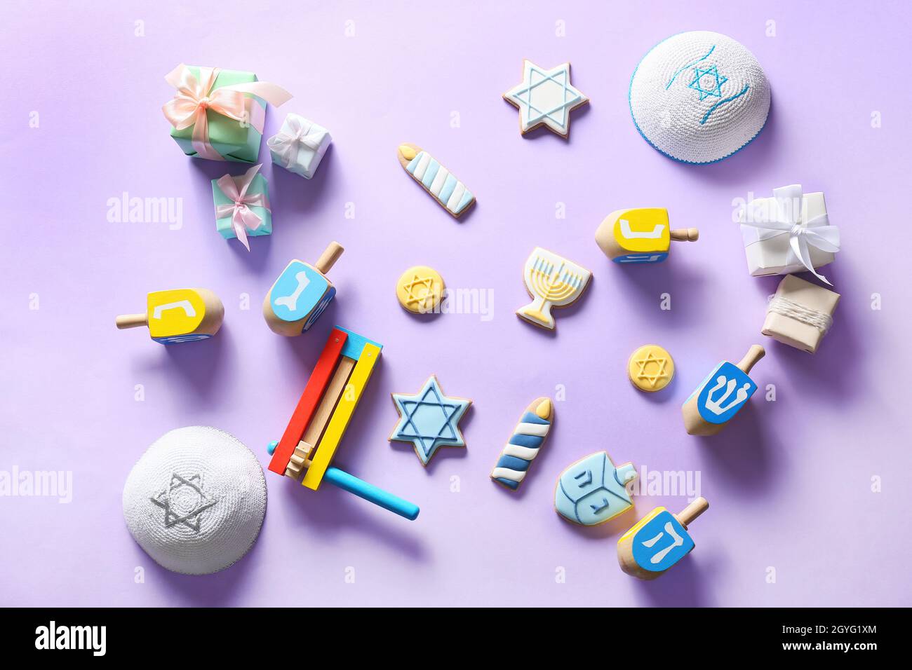 Different symbols of Hanukkah on color background Stock Photo - Alamy